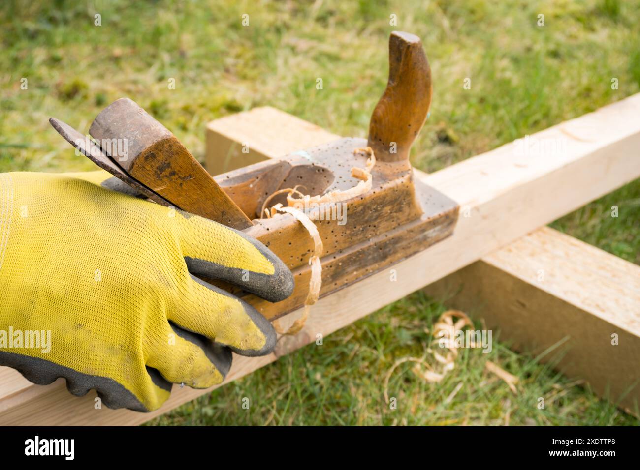 Horizontal high angle angle studio shot of small vintage wood planer ...