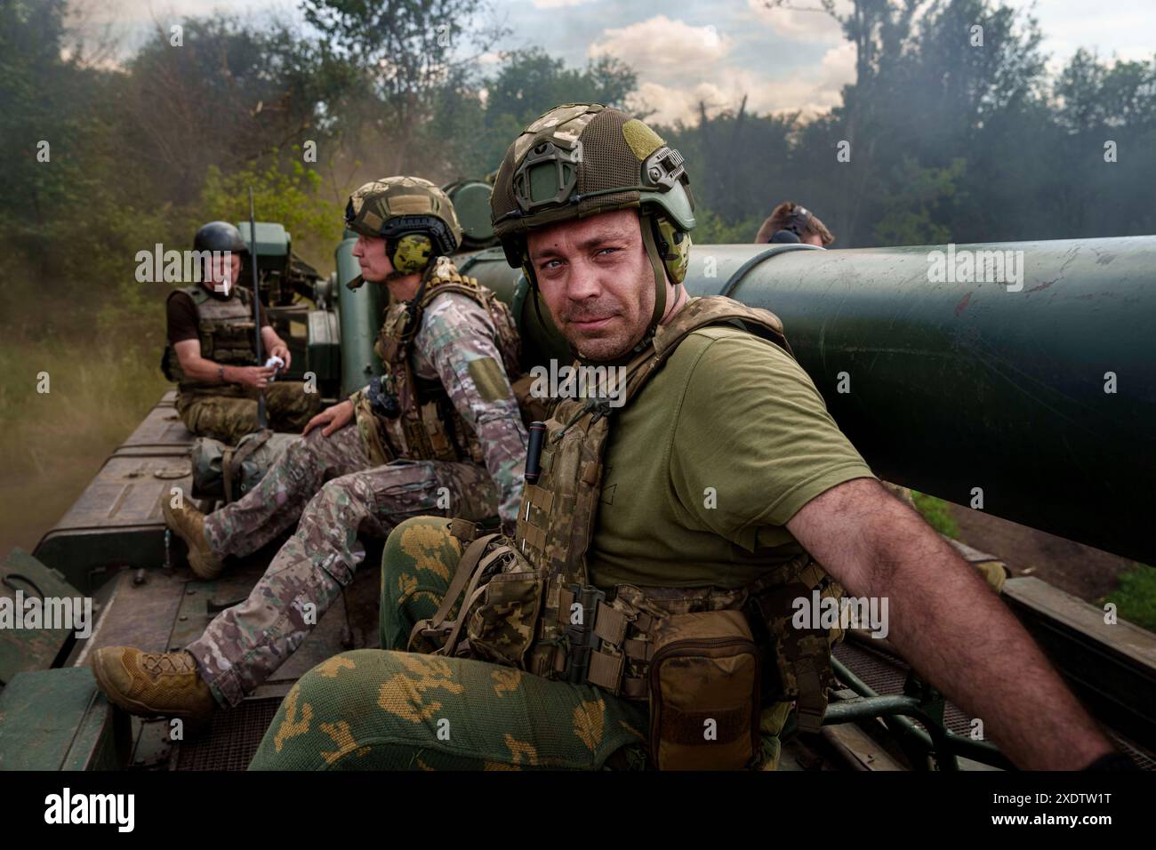 Ukrainian soldiers of 43rd artillery brigade ride atop on 2s7 self ...