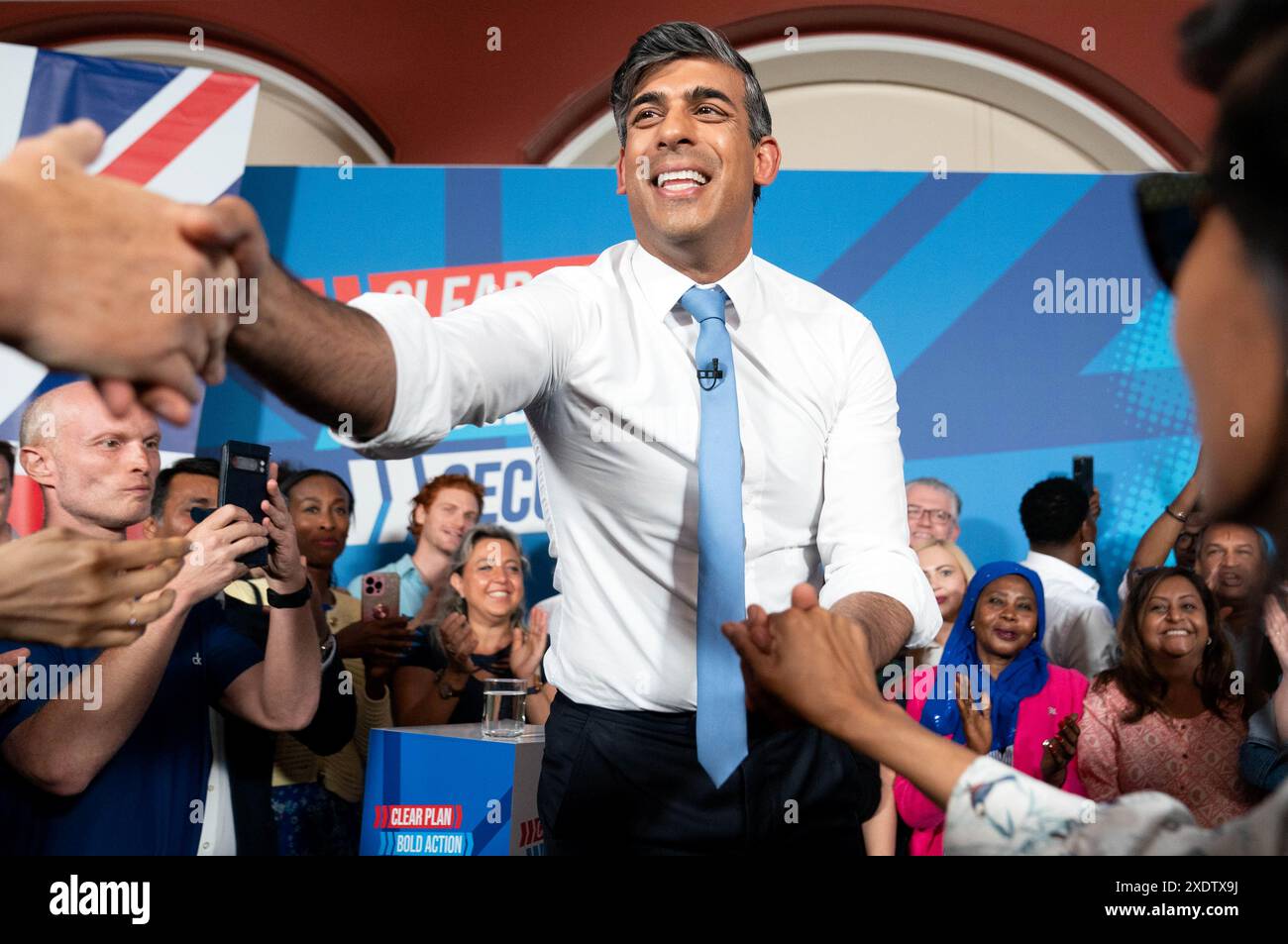 Prime Minister Rishi Sunak shake hands with members of the audience ...