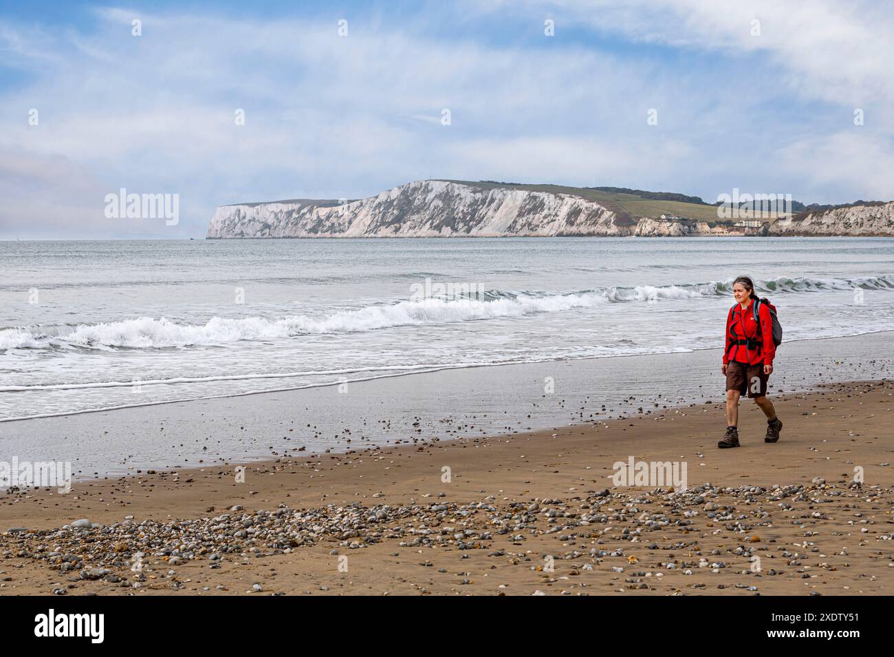 Hiker walking on beach, Compton Bay, Isle of Wight, England, UK Stock ...