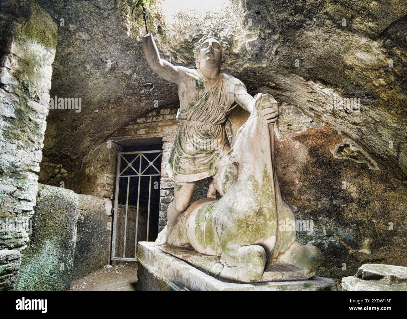 Statue of the god Mithras killing a bull in the thermal s mithraeum in ...