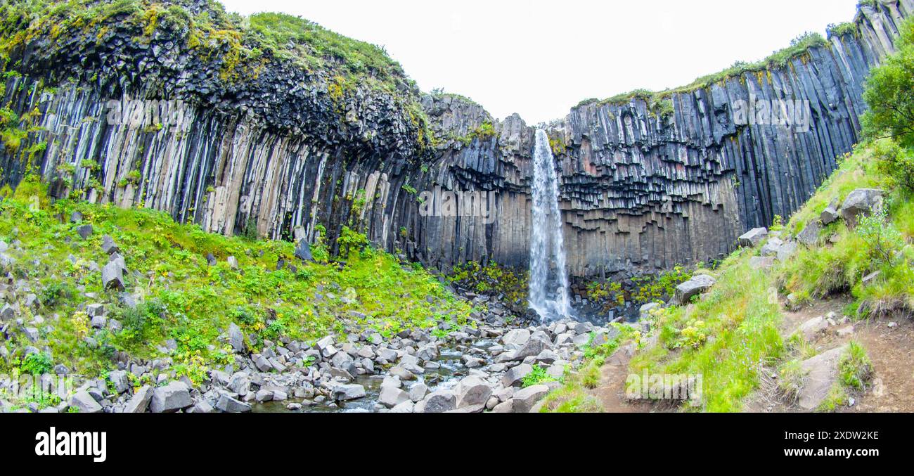 Svartifoss, known for its distinct basalt columns, cascades down the ...