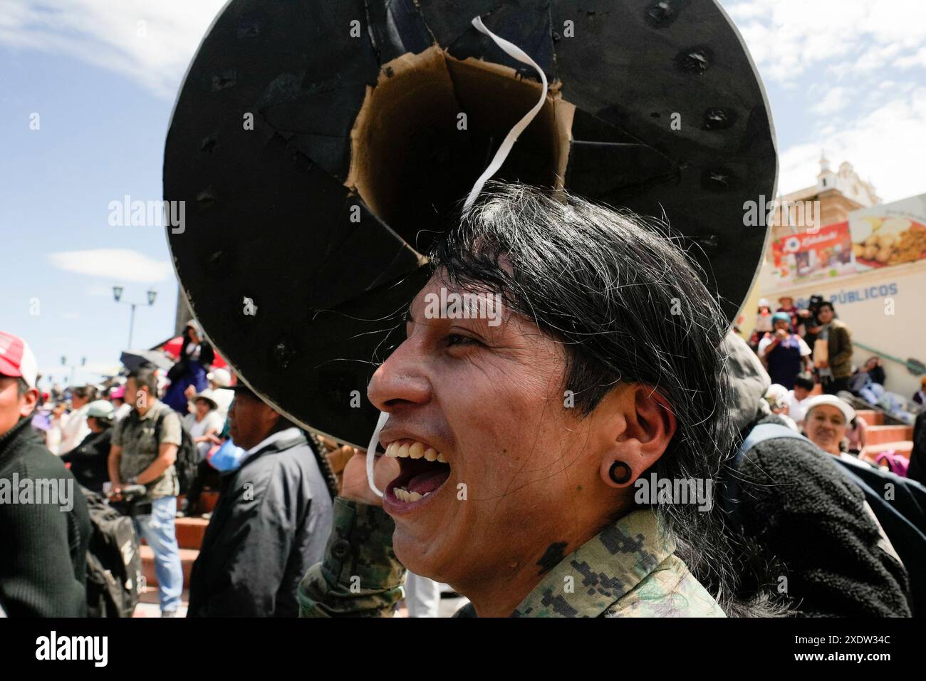 A person smiles at a ceremony in honor of the Indigenous Incan sun god ...