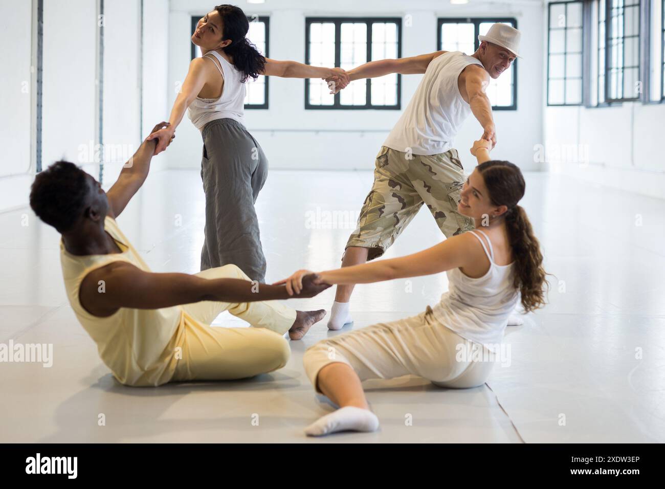 Group of artists demonstrating art performance Stock Photo - Alamy