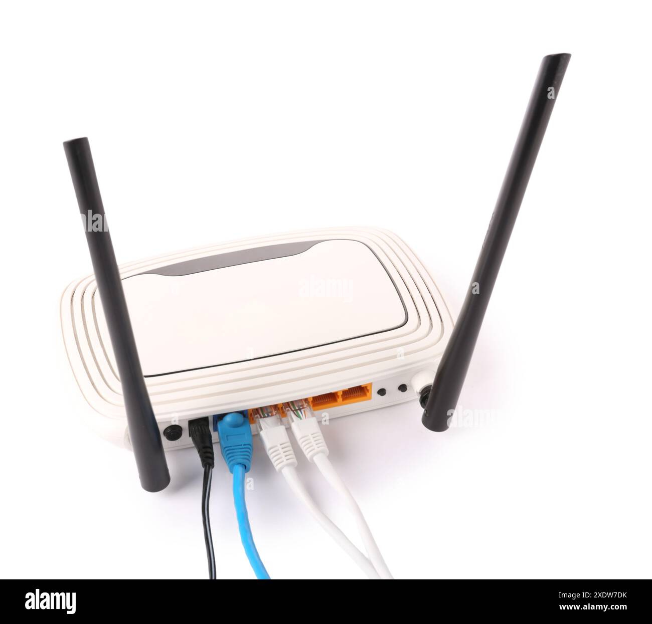 Modern wi-fi router with cables on white background Stock Photo - Alamy