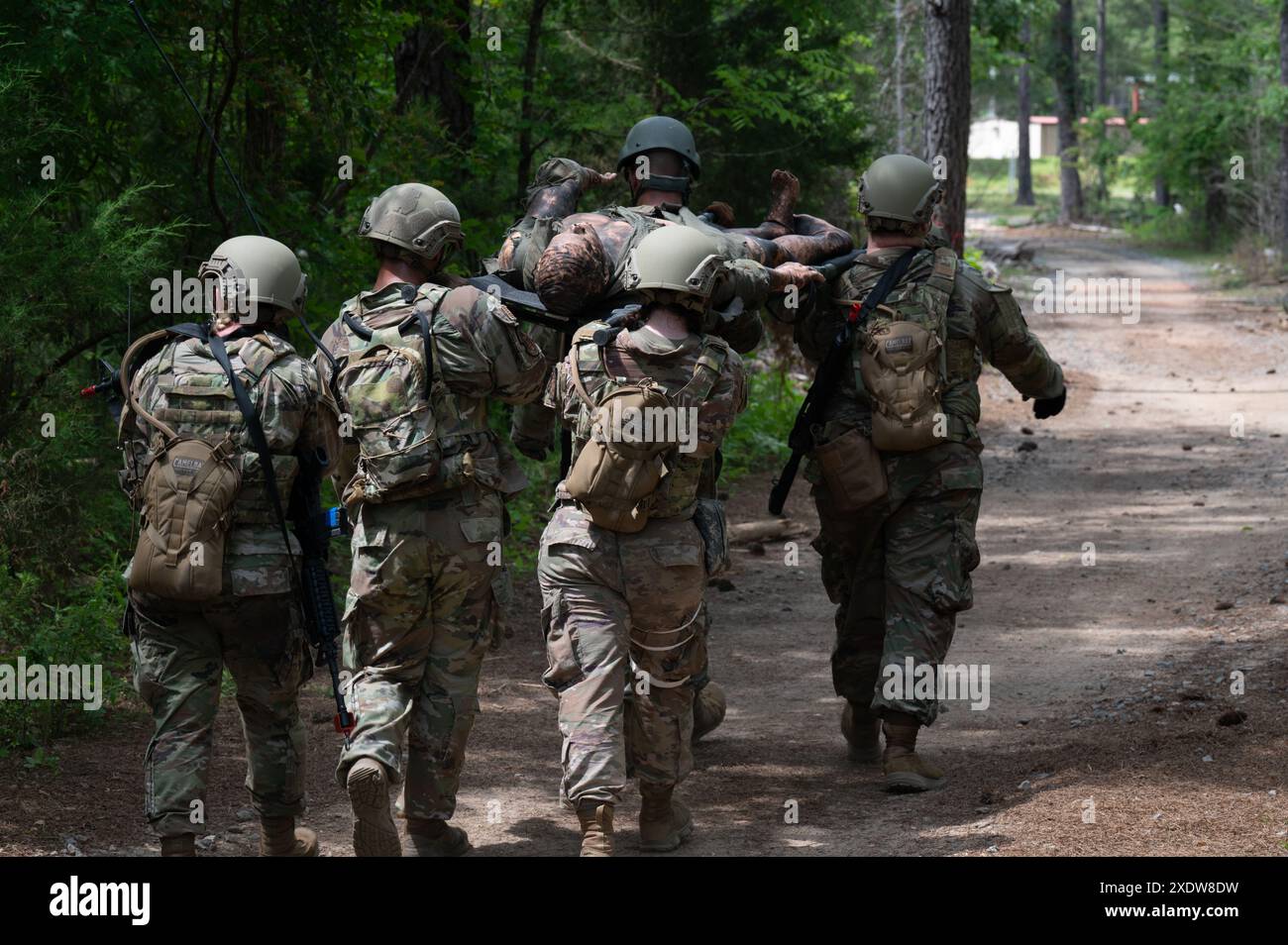 U.S. Air Force Airmen assigned to the 42nd Air Base Wing carry a ...