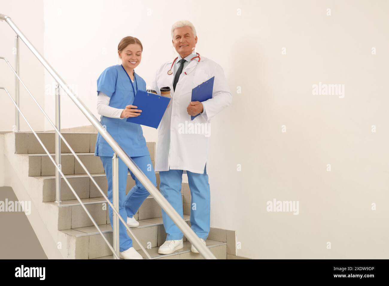 Doctor nurse in stairs hi-res stock photography and images - Alamy