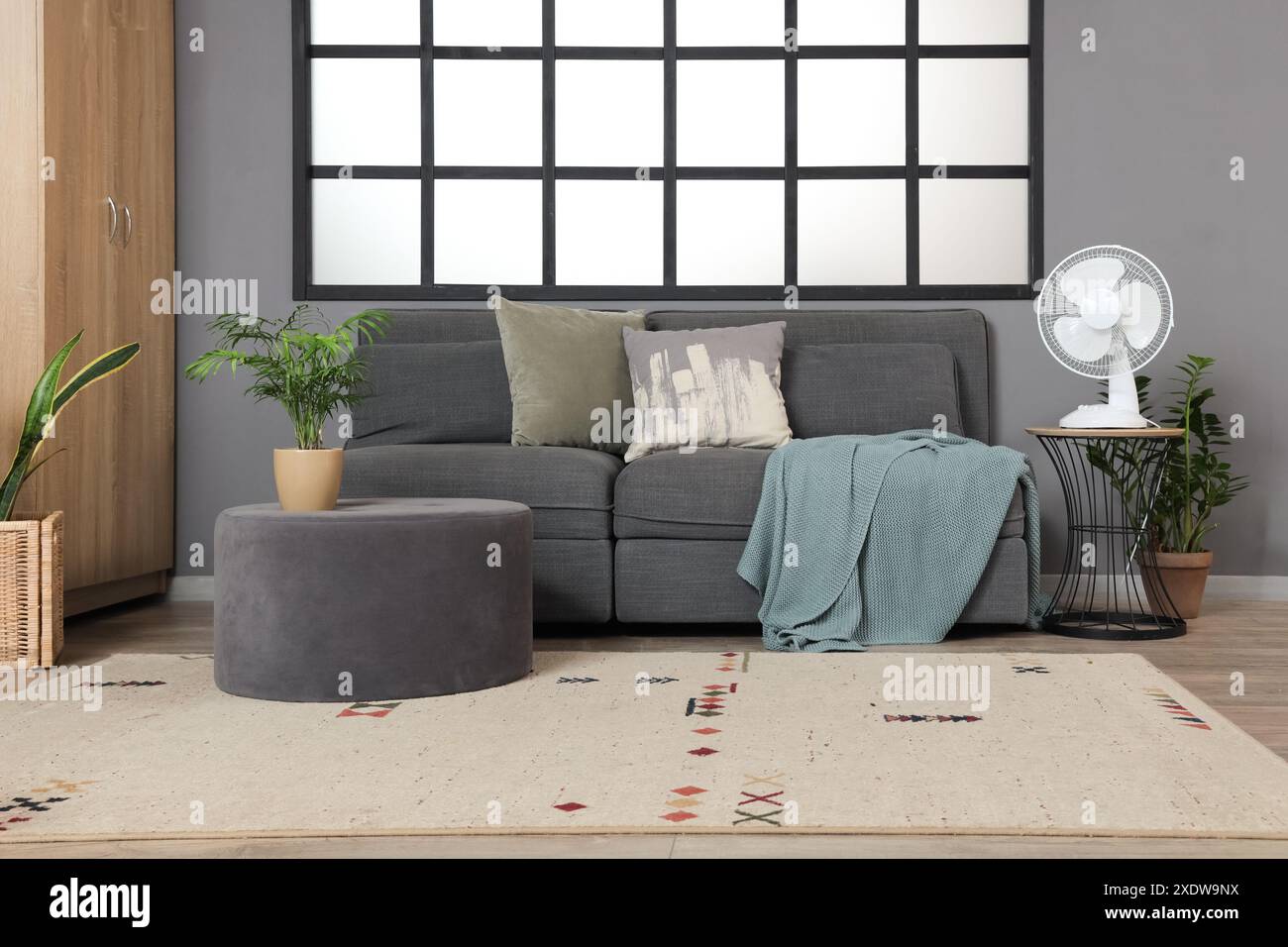 Electric fan on coffee table at home Stock Photo - Alamy