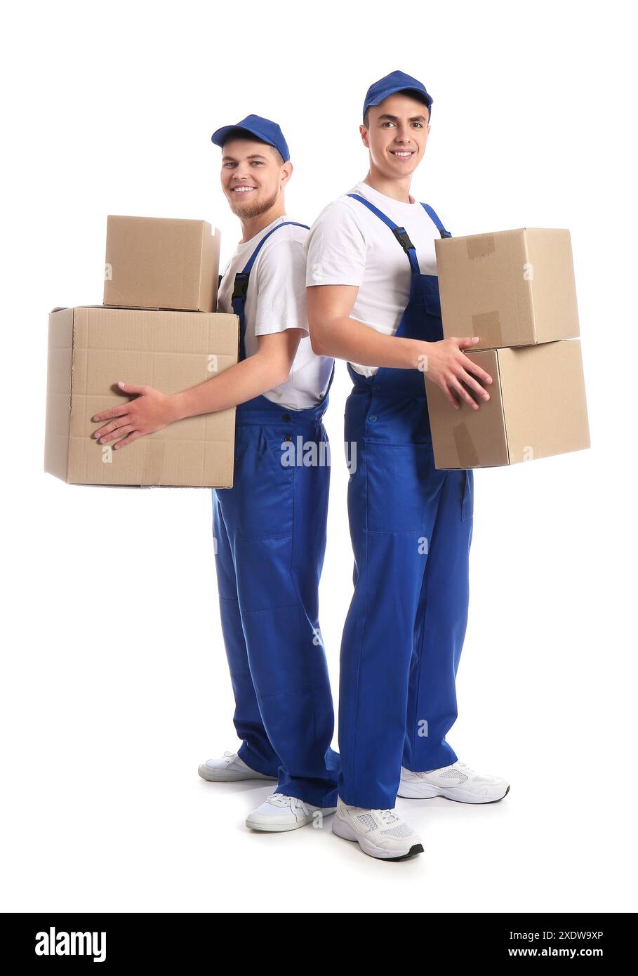 Loaders carrying cardboard boxes on white background Stock Photo - Alamy