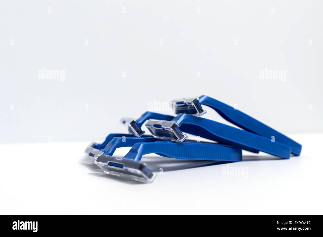 Many Manual Disposable Blue Plastic Razors On White Background With ...