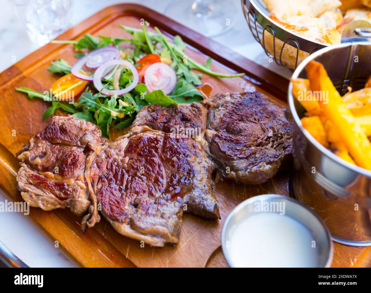 Fried beef served with French fries Stock Photo - Alamy