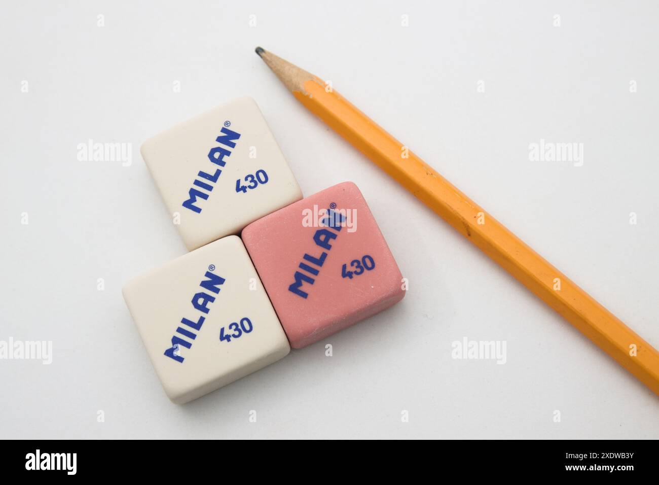 Three White And Pink Erasers From The Milan Brand Model 430 Next To A