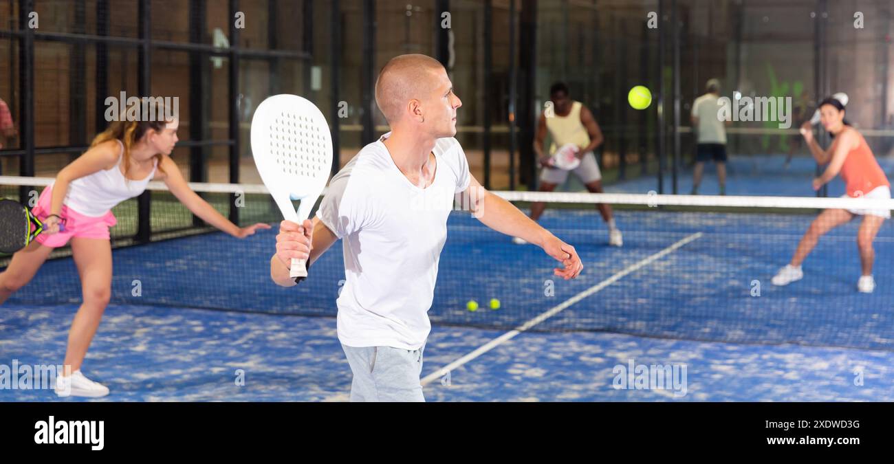 Padel tennis couple in court ready for play Stock Photo - Alamy