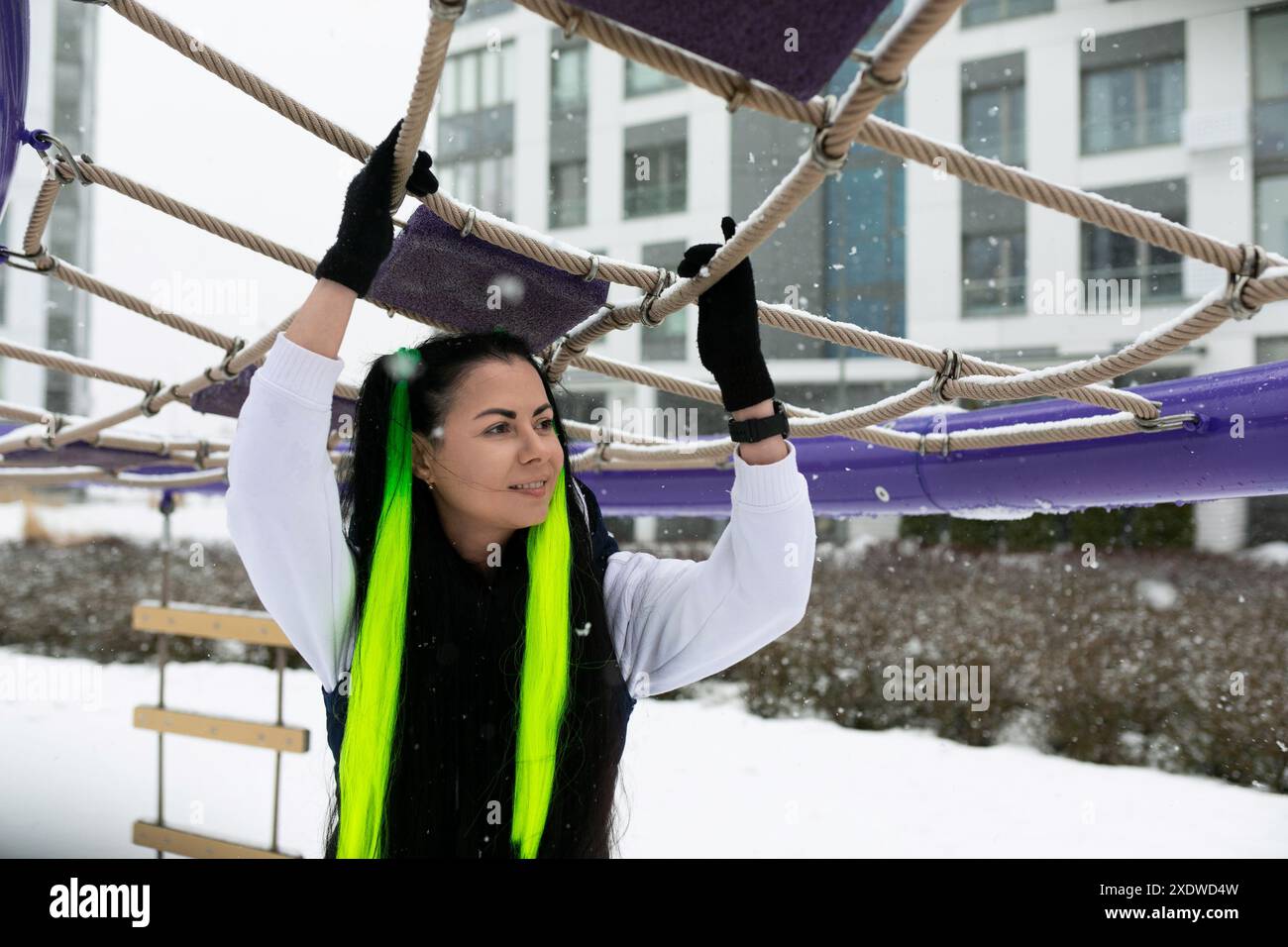 Woman Holding Onto Rope in Snow Stock Photo - Alamy