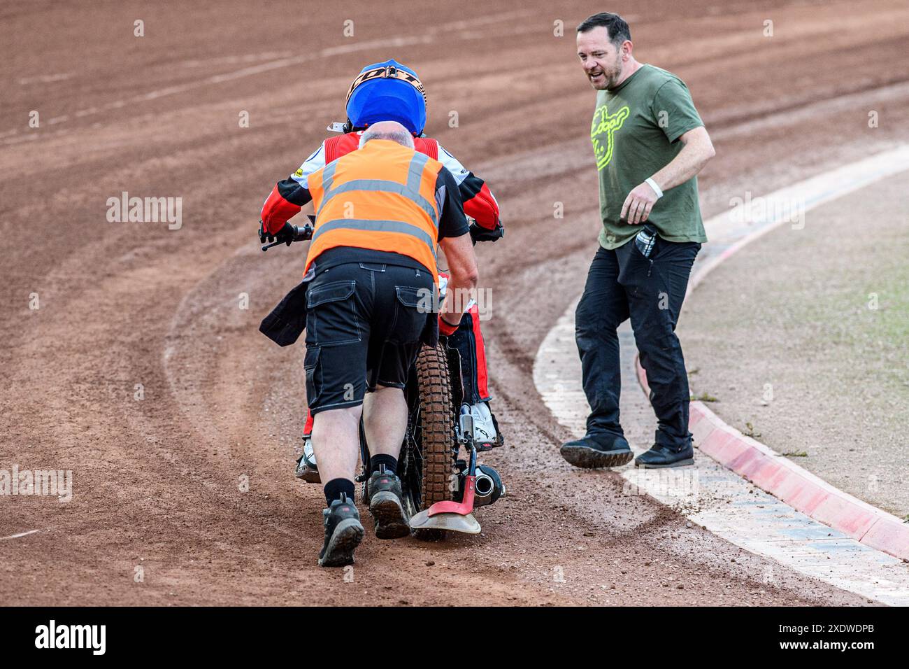 Belle Vue Aces' Ben Cook gets a push from a member of the track staff ...