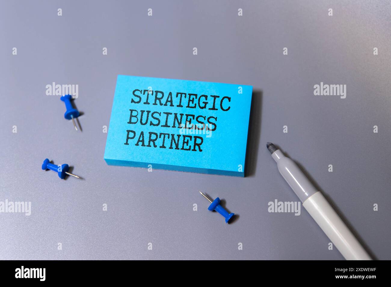 Strategic business partner text on paper on the chart background with ...