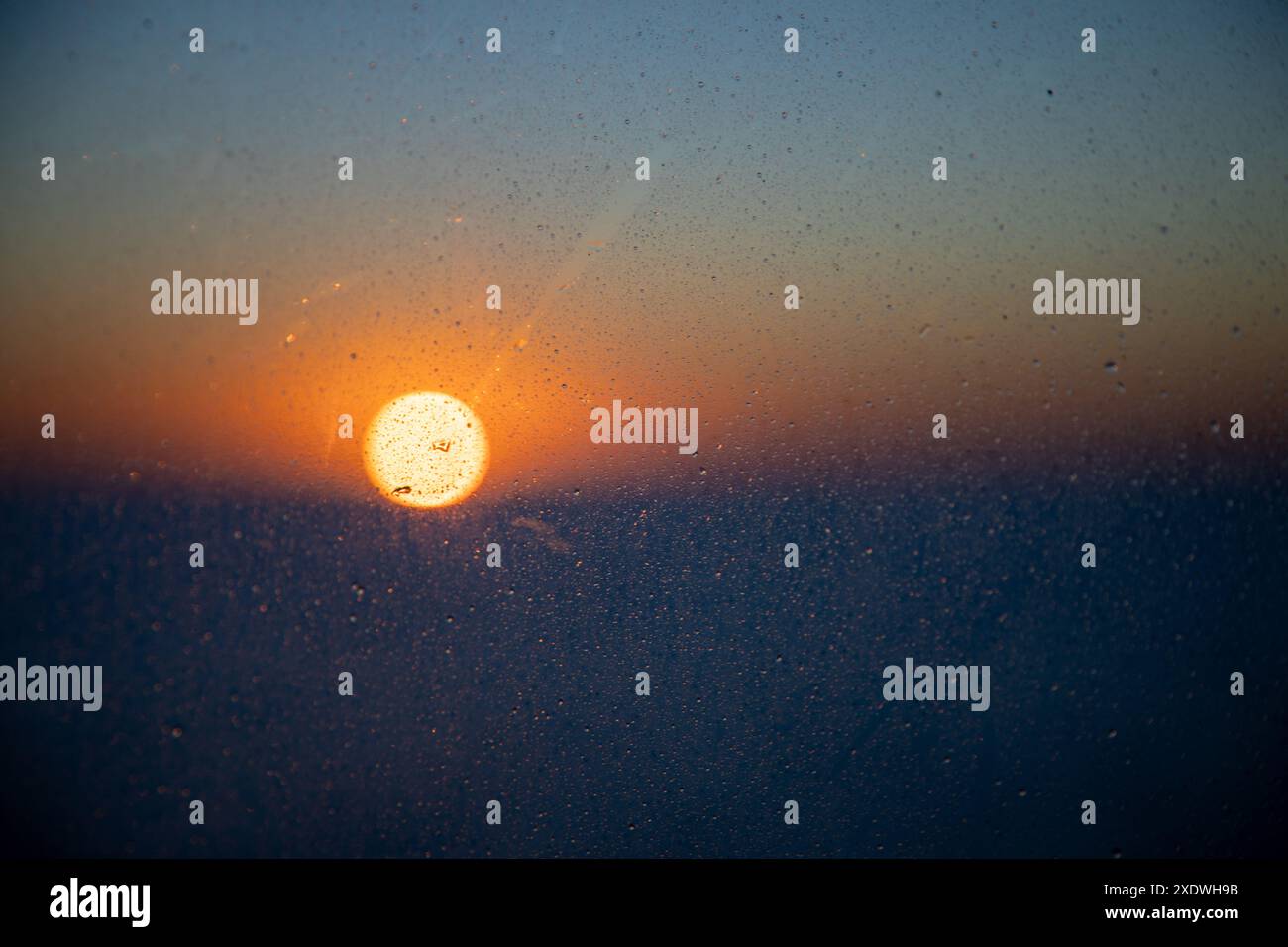 sunset through a raining window Stock Photo - Alamy