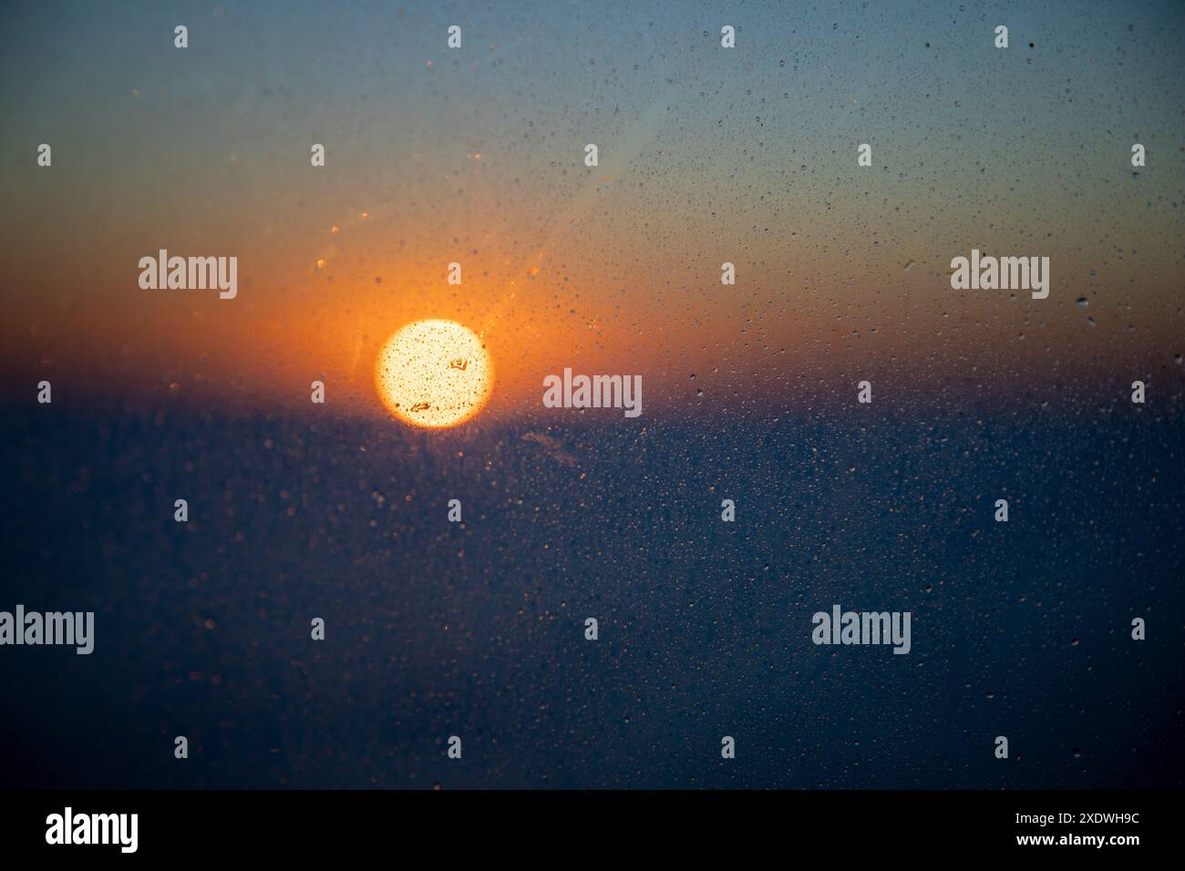 sunset through a raining window Stock Photo - Alamy