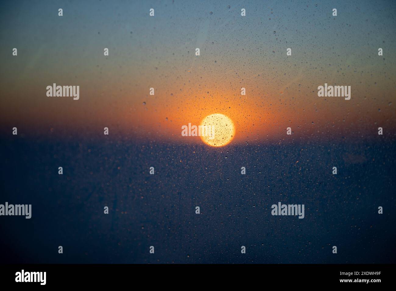 sunset through a raining window Stock Photo - Alamy