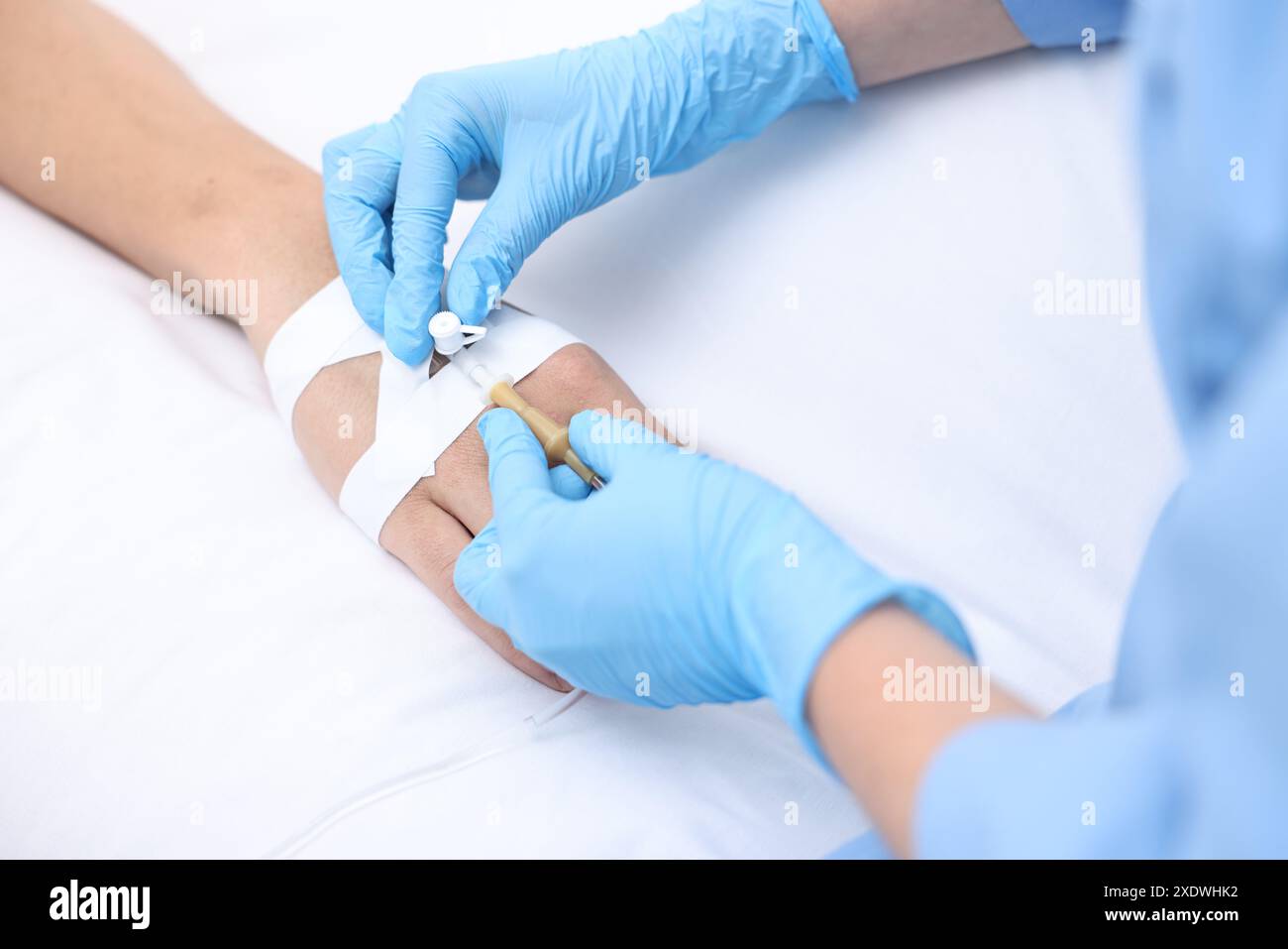 Nurse inserting iv arm hi-res stock photography and images - Alamy