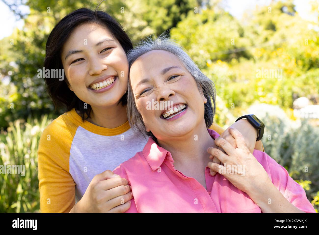 Mother daughter embracing in park hi-res stock photography and images - Alamy