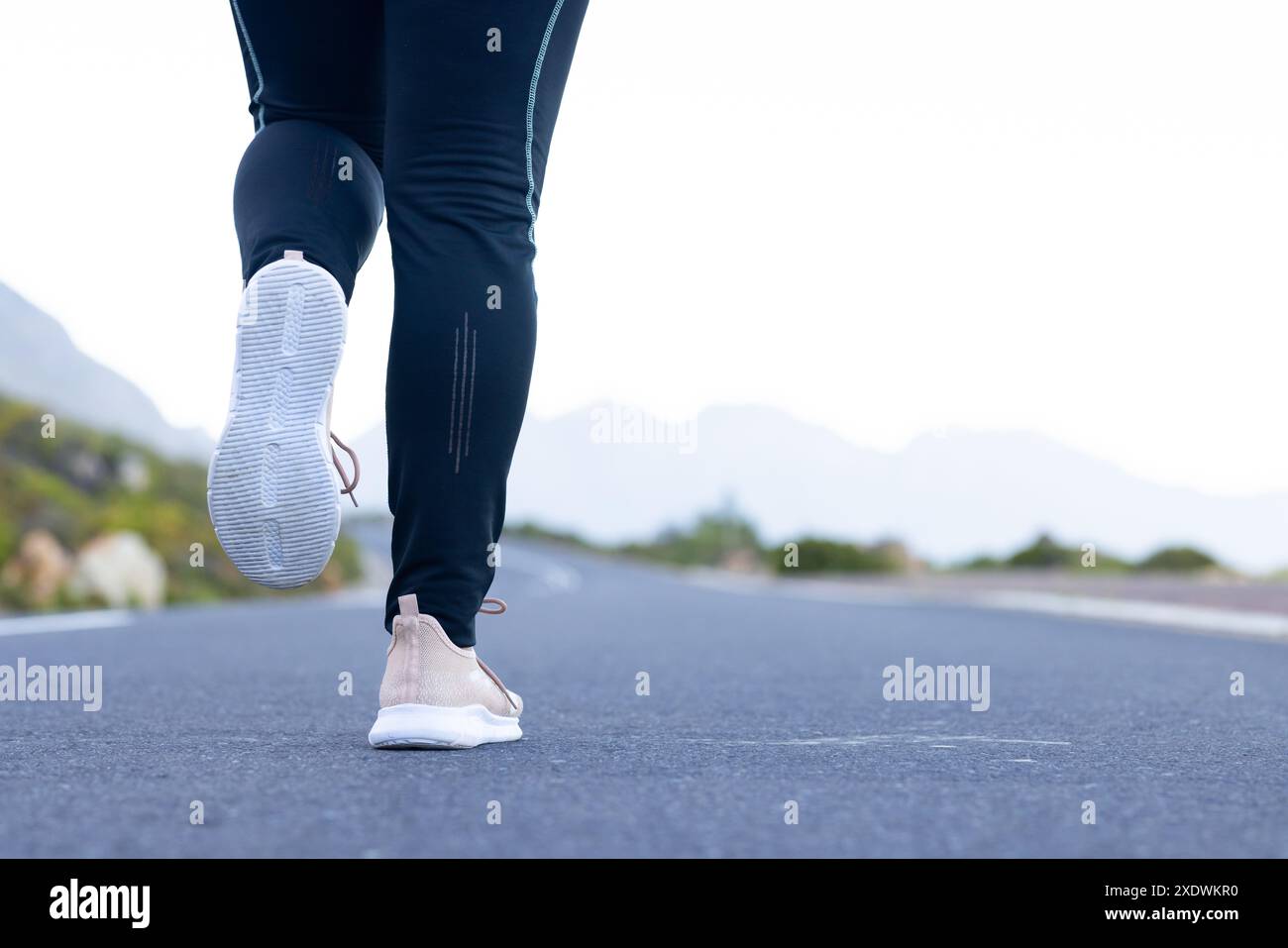 Person running road mountain hi-res stock photography and images - Alamy
