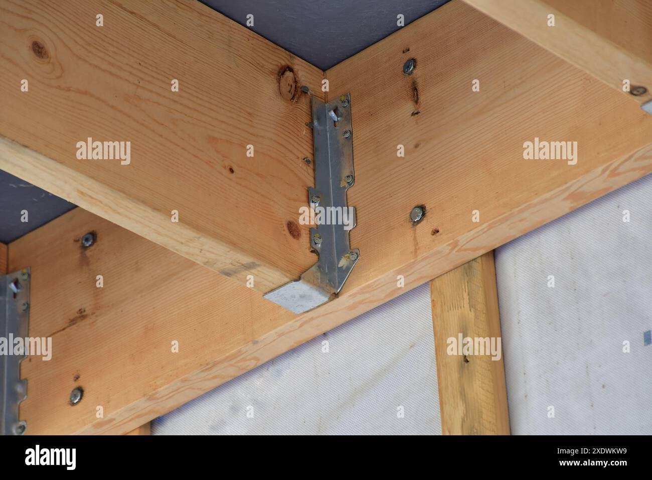 Floor joist galvanized hanger wood beam installation. Stabilizing face ...