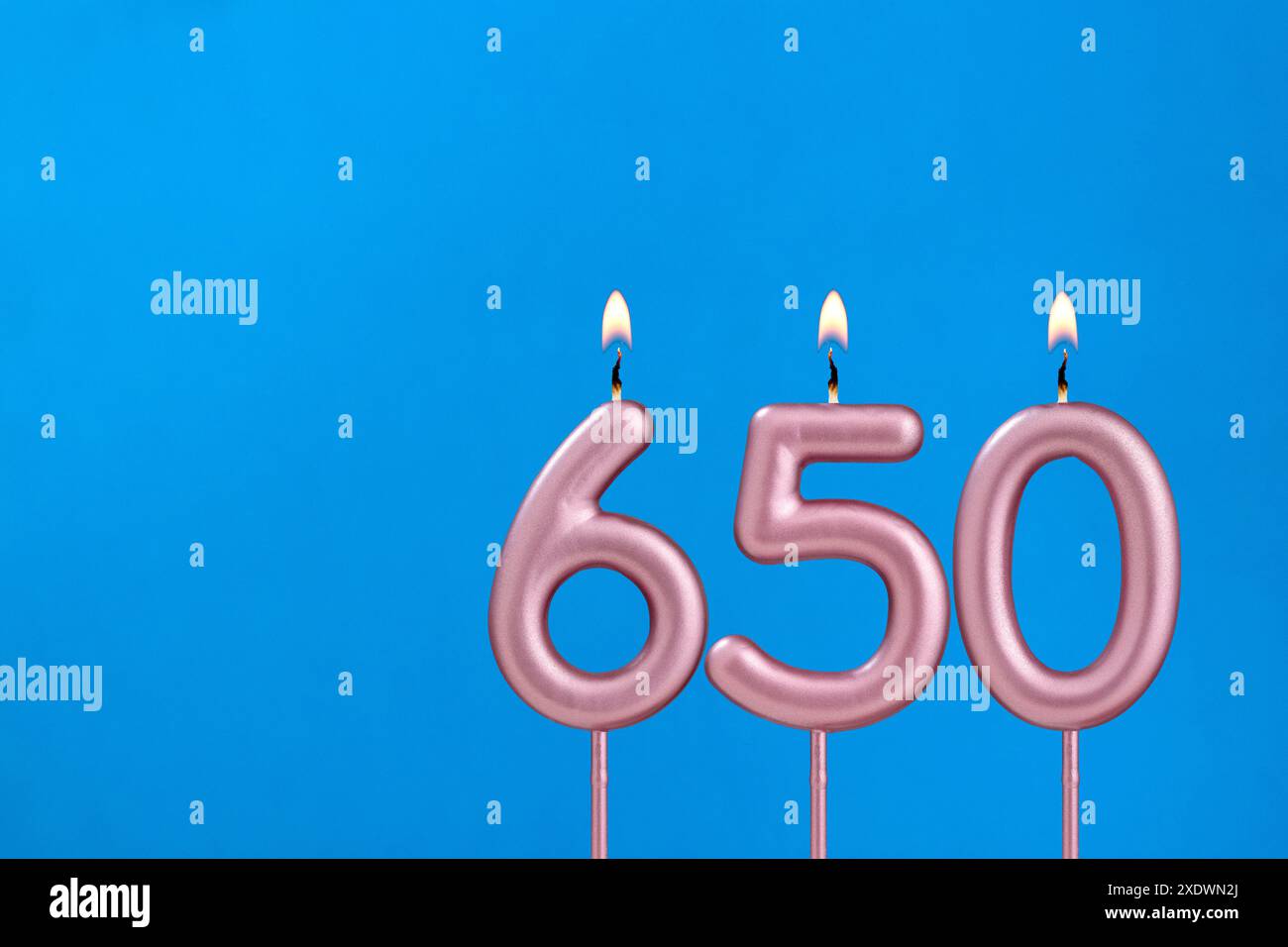 Birthday card with number 650 - Burning anniversary candle on blue ...