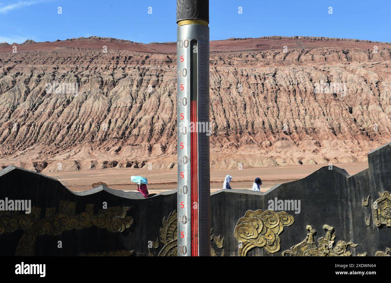 TURPAN, CHINA - JUNE 24, 2024 - Tourists visit the Flaming Mountain ...