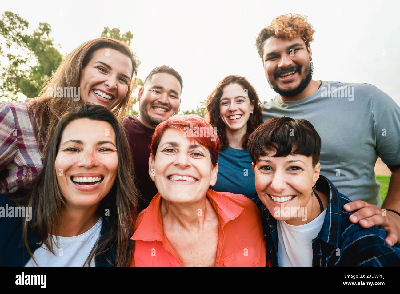 Multiracial friends with different age and ethnicity having fun taking ...