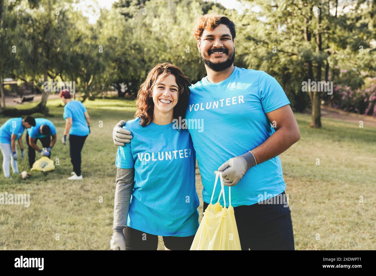 Environmental activists friends picking up garbage trash at park city ...