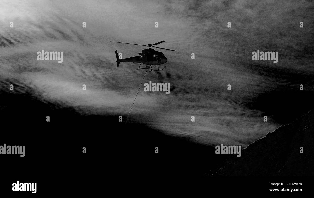 Helicopter flying at night Stock Photo - Alamy