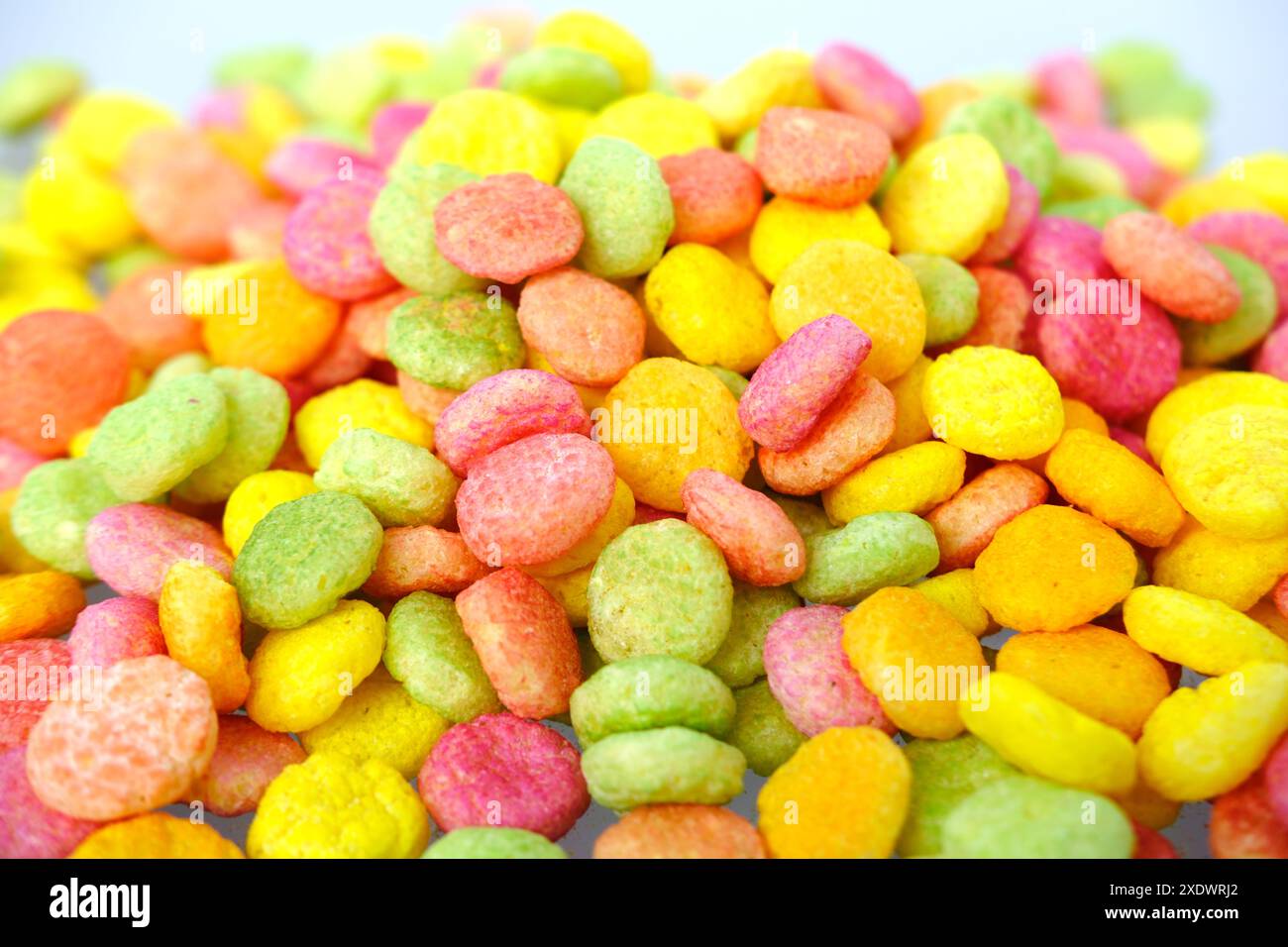 colorful rainbow multi-colored Round corn snacks, button-shaped ...