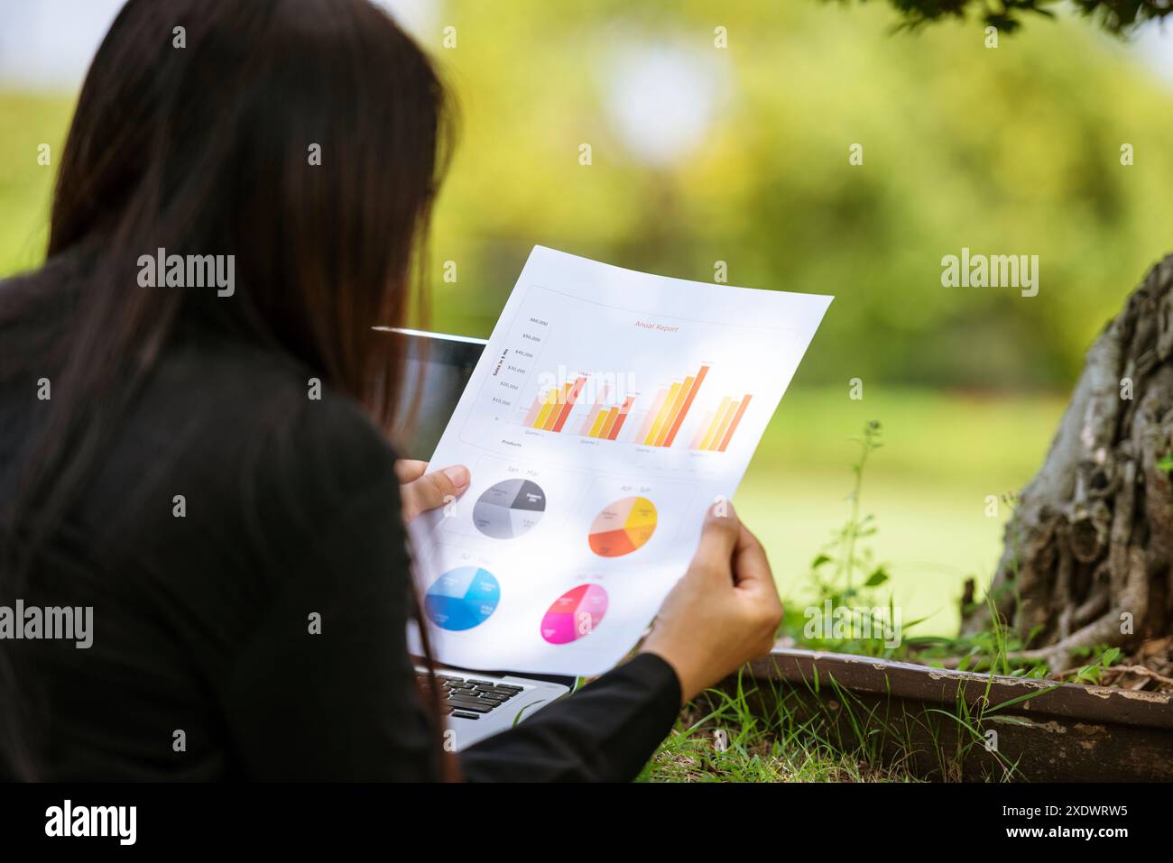 Asian entrepreneur business woman reading business graph analyze chart ...