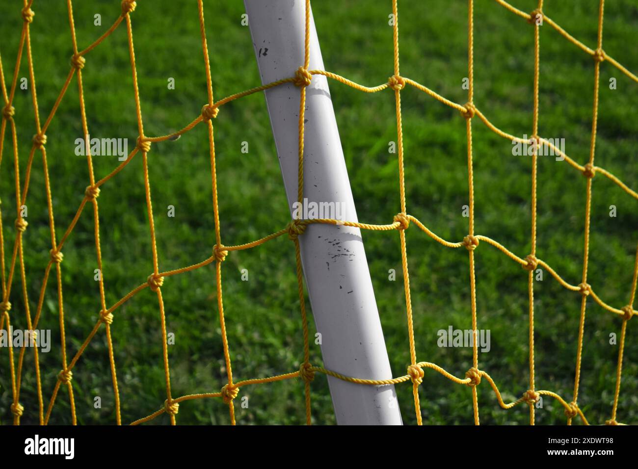 Football goal in the football field in the morning with a sunset ...