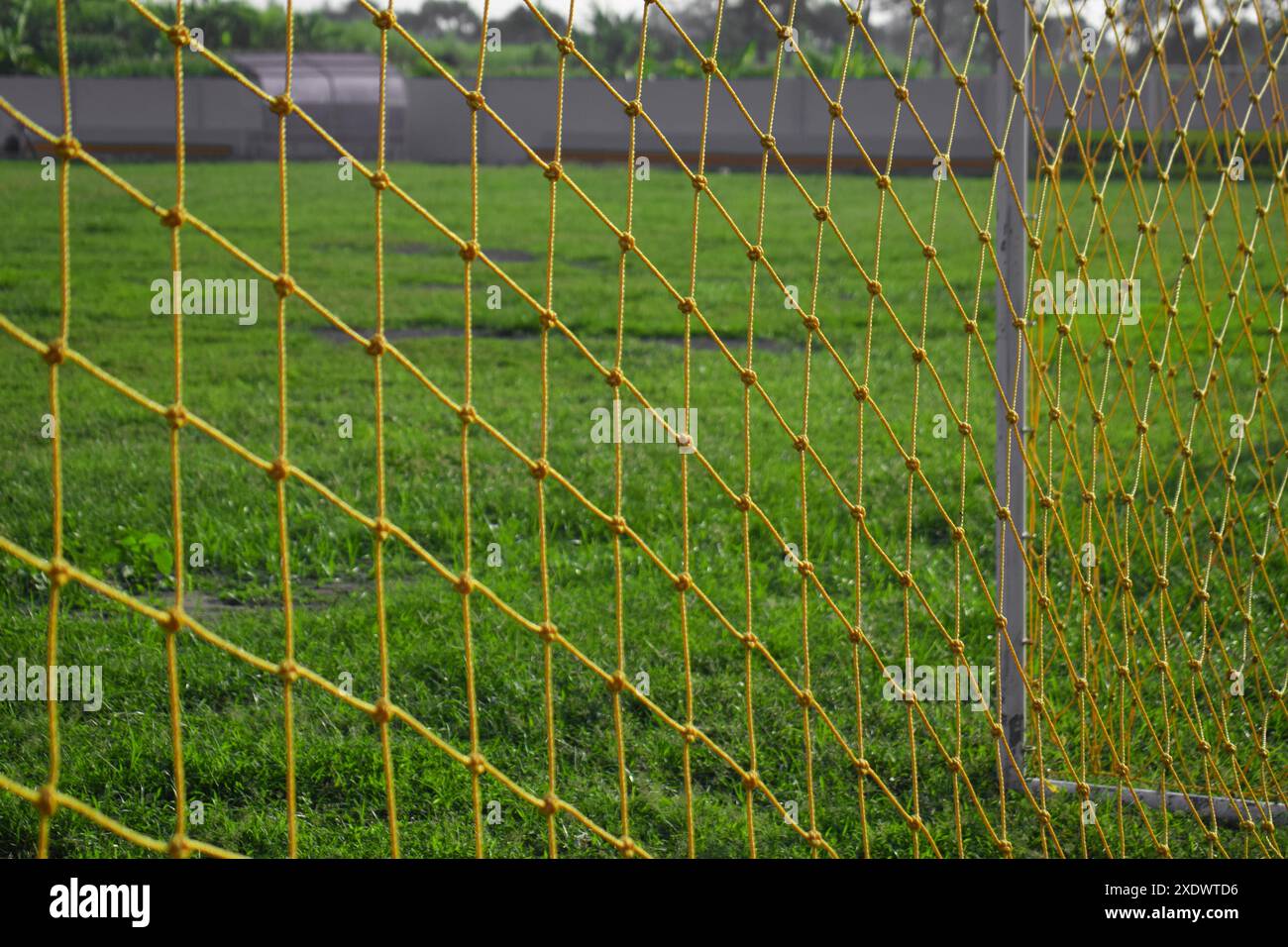 Football goal in the football field in the morning with a sunset ...