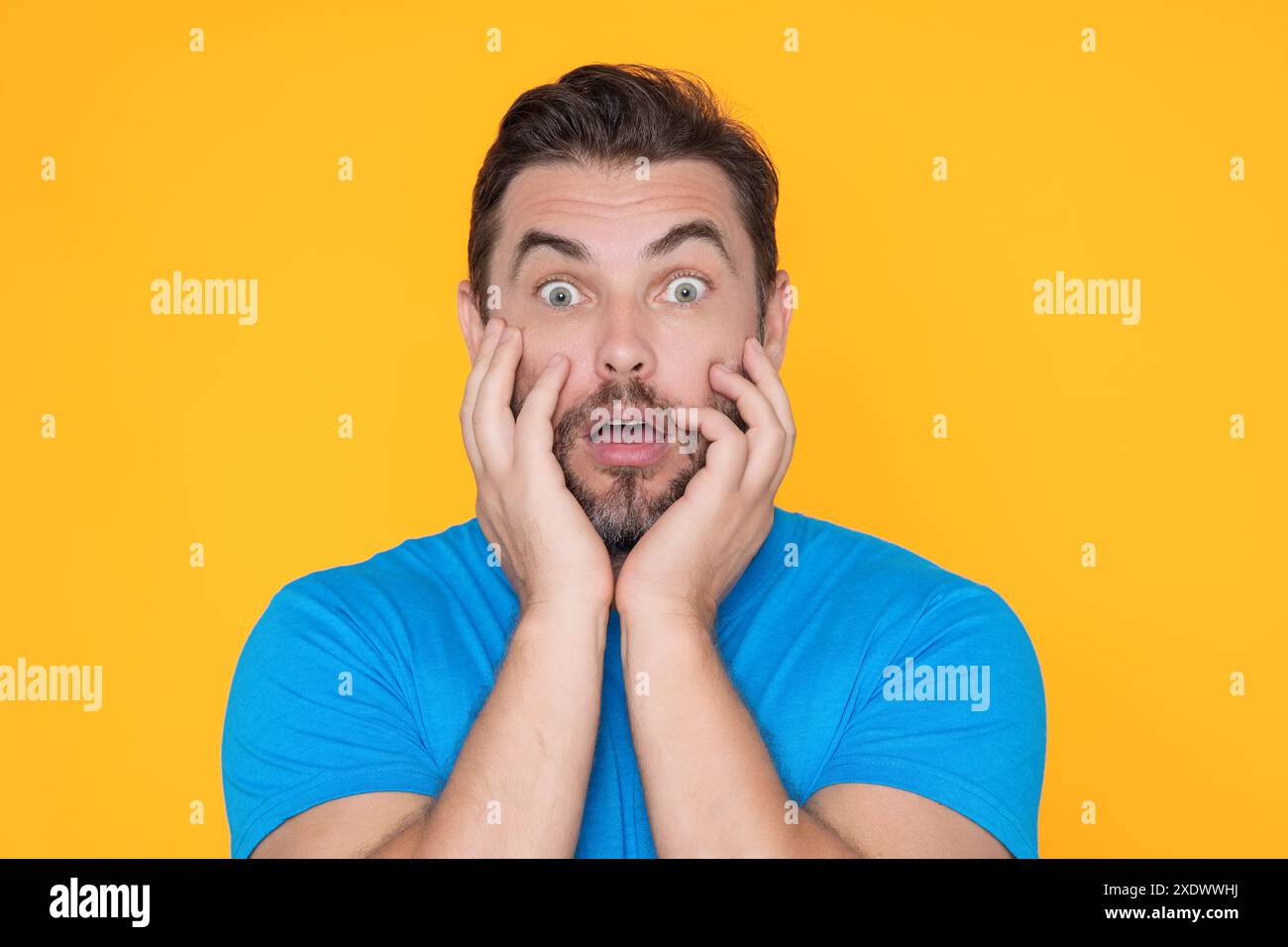 Portrait of surprised man. Wow, it's unbelievable. Shocked man opening ...