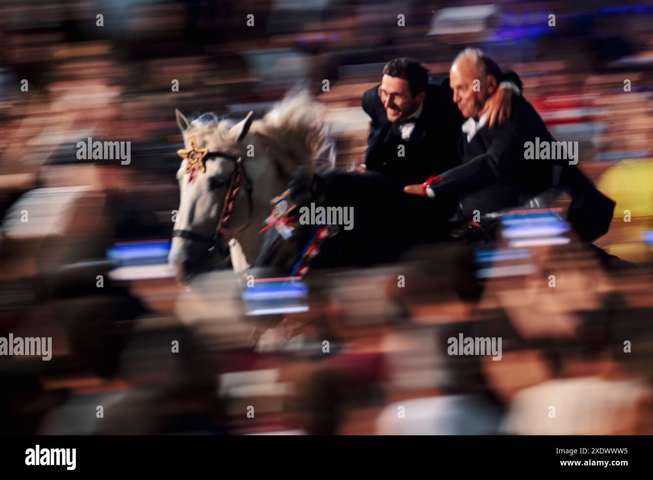 Ciutadella, Spain. 24 June, 2024: Two 'caixers' (horse riders) gallop ...