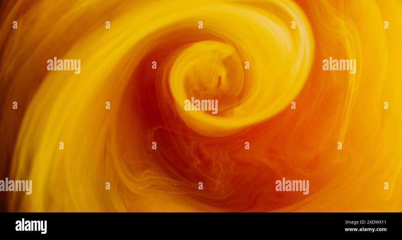 Color mist swirl. Paint water mix. Defocused orange yellow glowing ...