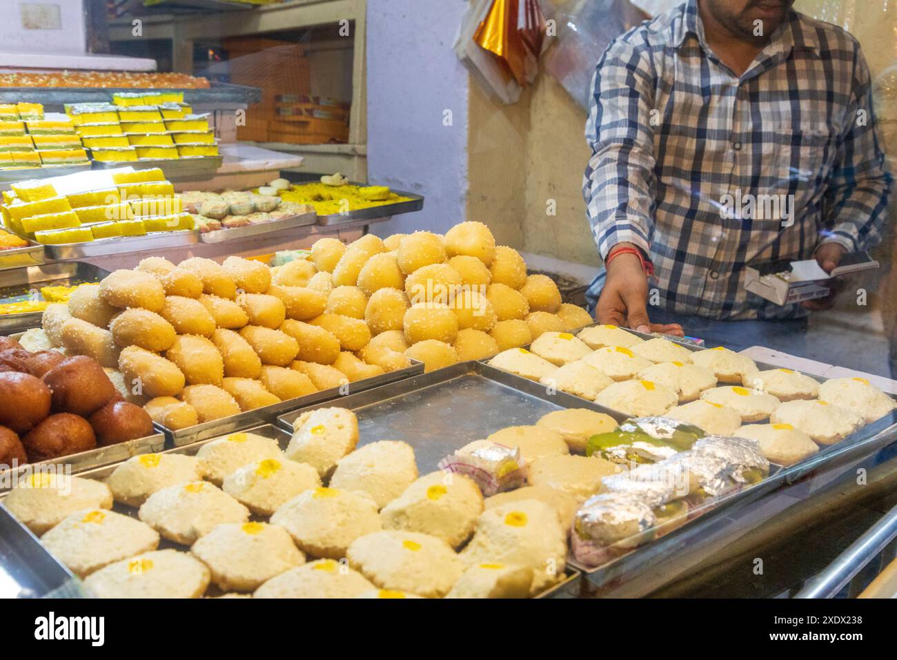 India, Uttar Pradesh, Varanasi. Sweet pastries being sold on the street ...