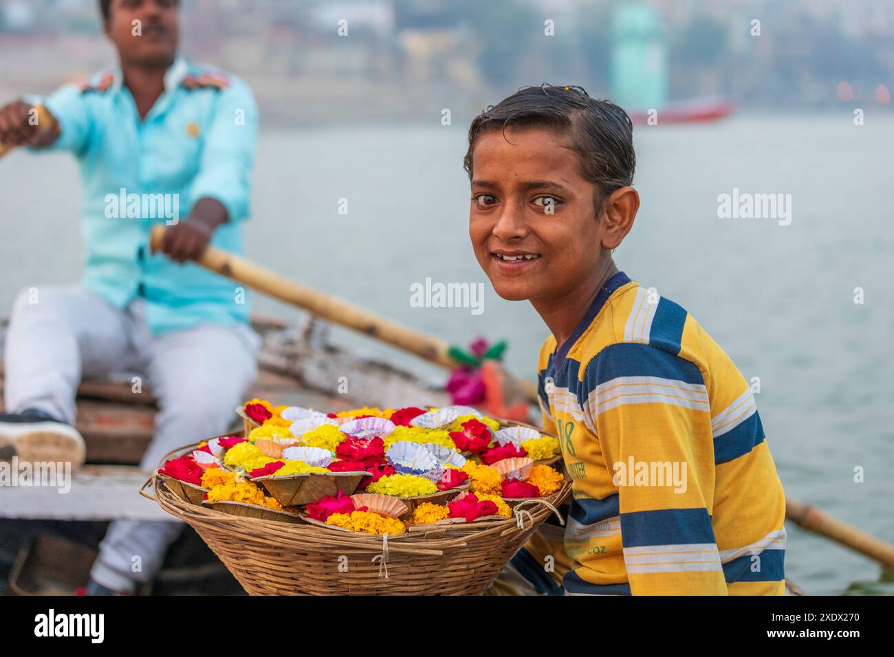 Child offering flower hi-res stock photography and images - Alamy