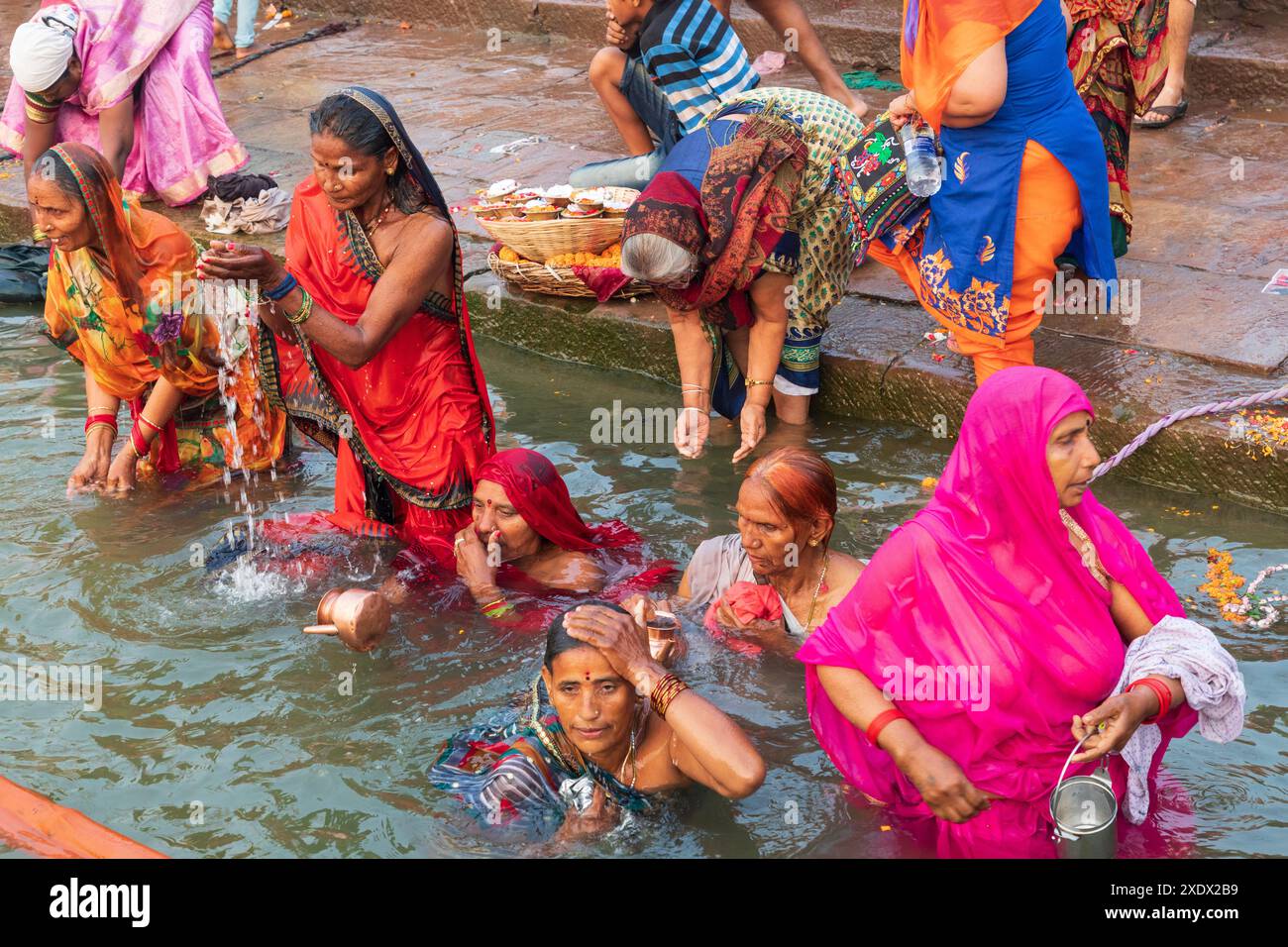 India, Uttar Pradesh, Varanasi. People bathing in the Ganges Stock ...