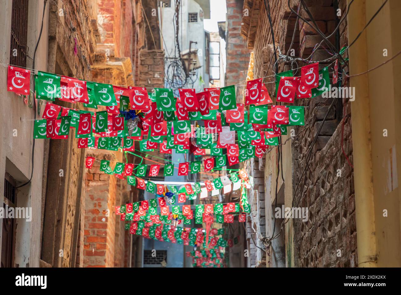 India, Uttar Pradesh, Varanasi, Bangali Tola. Red and green Islamic ...