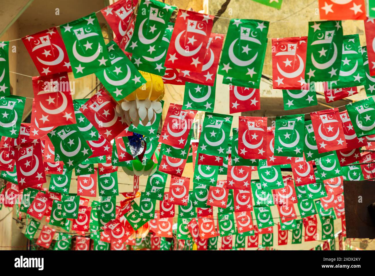 India, Uttar Pradesh, Varanasi, Bangali Tola. Red and green Islamic ...