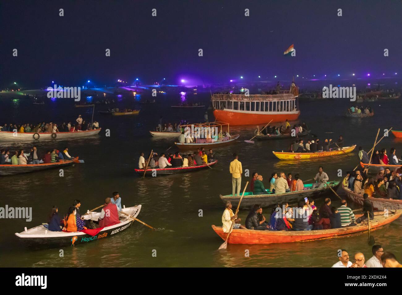 India, Uttar Pradesh, Varanasi. People on tourist boats viewing the ...