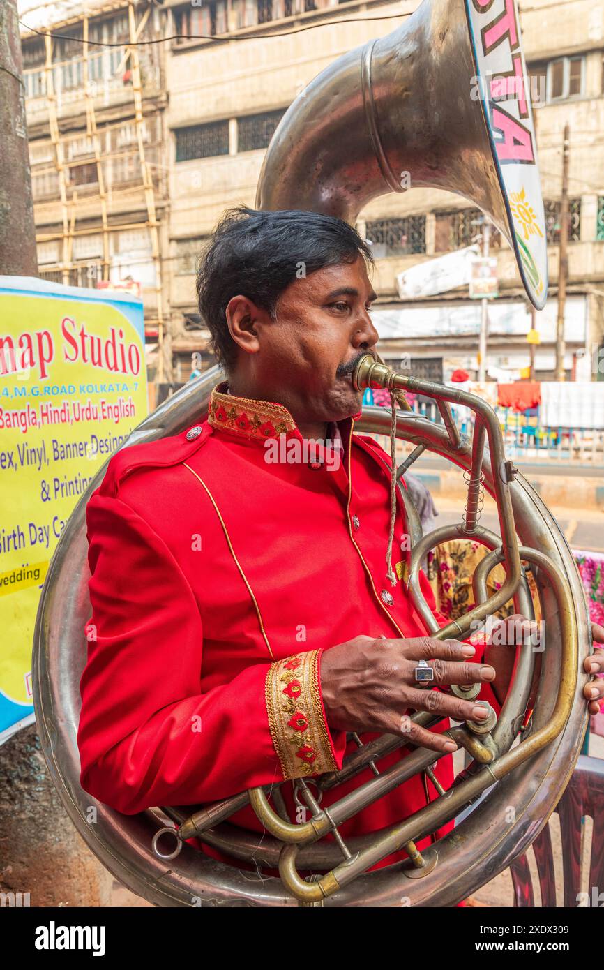 India, West Bengal, Kolkata, Jorasanko. Man playing a sousaphone Stock ...