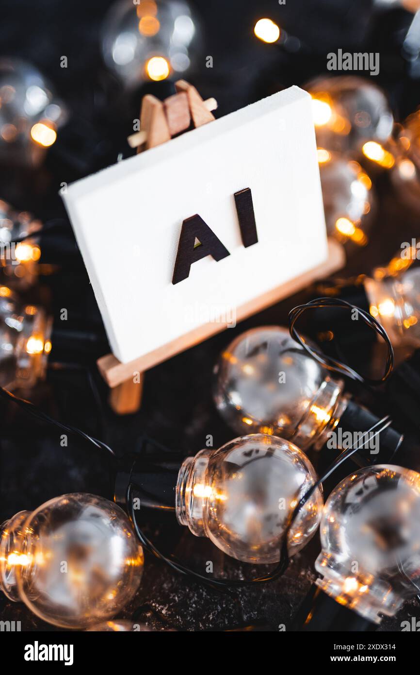 AI text on canvas on easel with light bulbs around it, art and machine ...