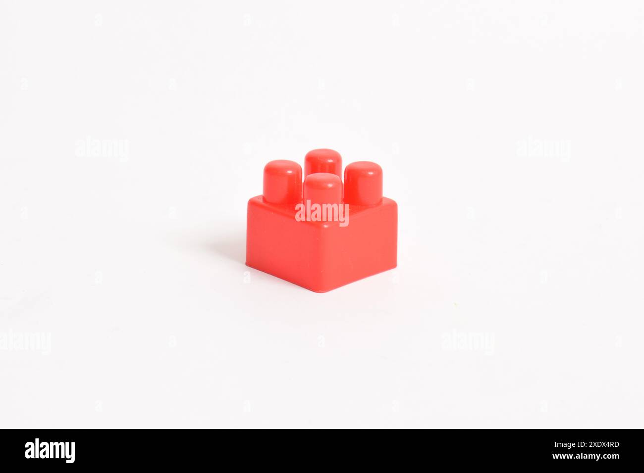 Red Plastic toy blocks isolated on white background. Building Blocks ...