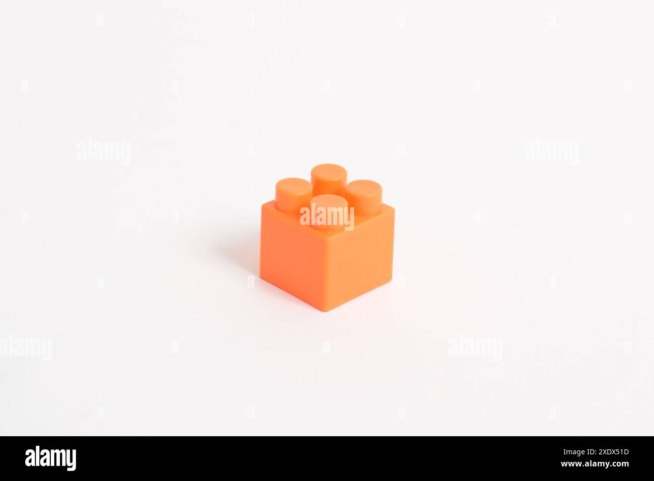 Orange Plastic toy blocks isolated on white background. Building Blocks ...