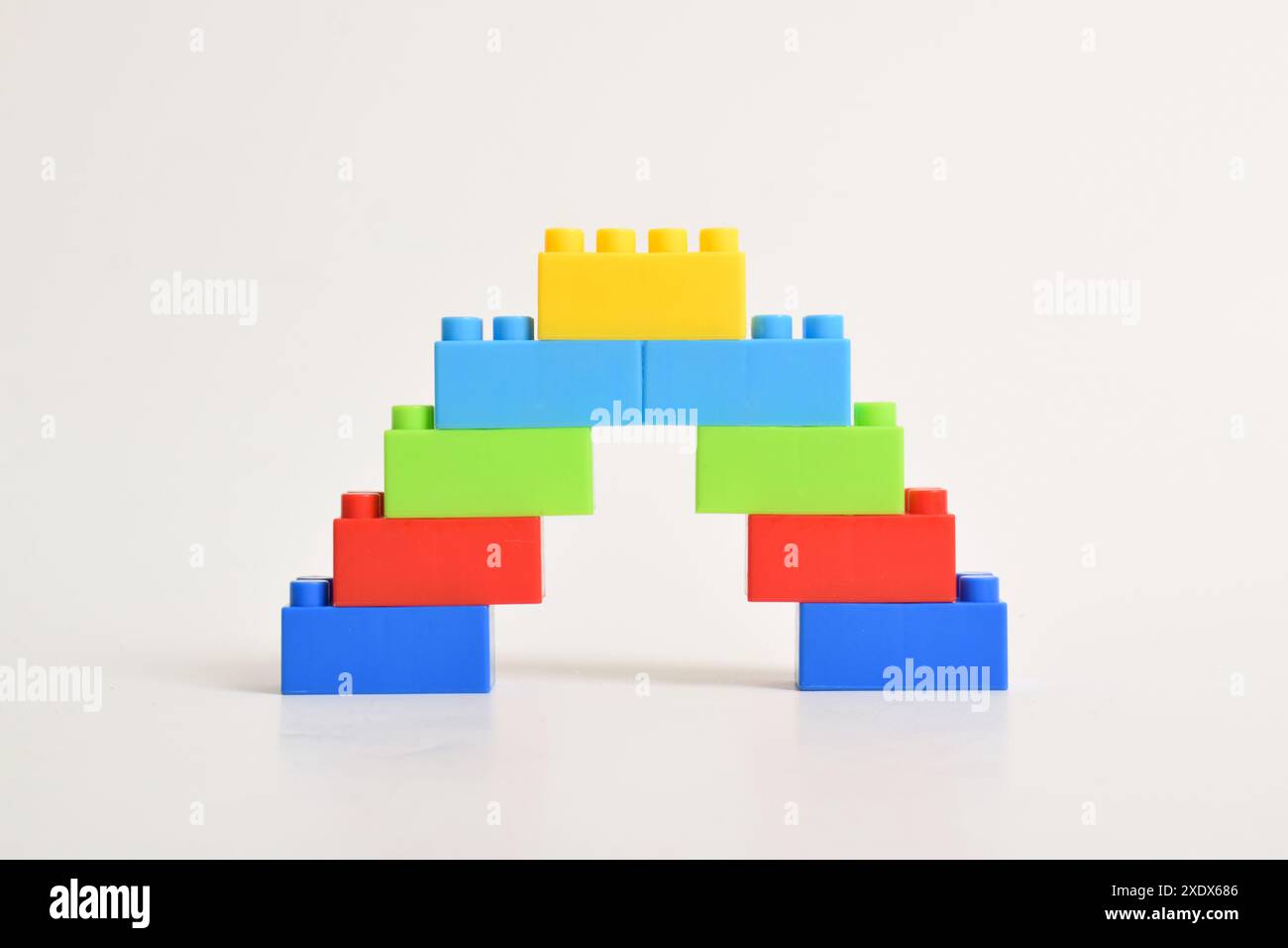 A rainbow color lego stairs isolated on white background. Building ...